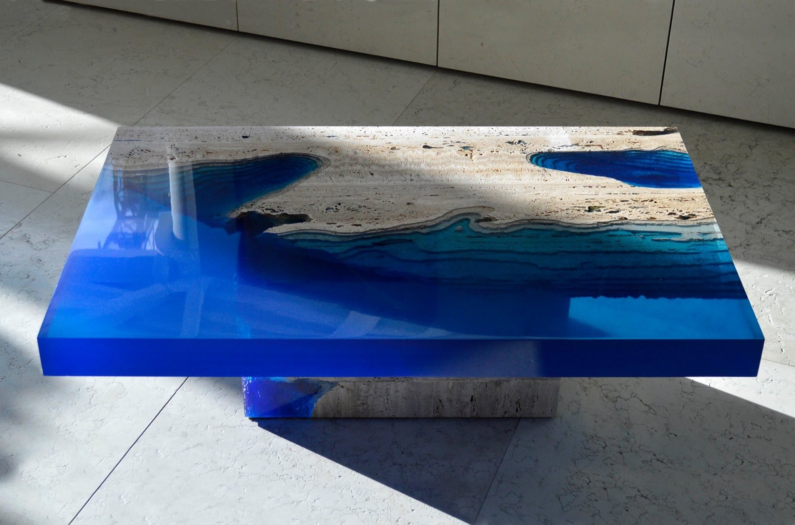 Lagoon Tables Built By Merging Resin With Cut Travertine Marble | FREEYORK